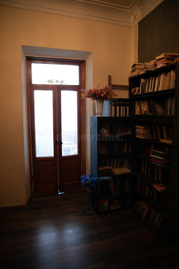 A Shelf with Books in a Dark Room in the Library Stock Photo - Image of ...