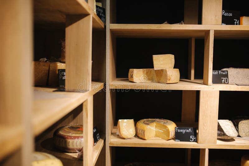 Shelf with Cheese in Cheese Store. Assortment of Different Cheese Types ...
