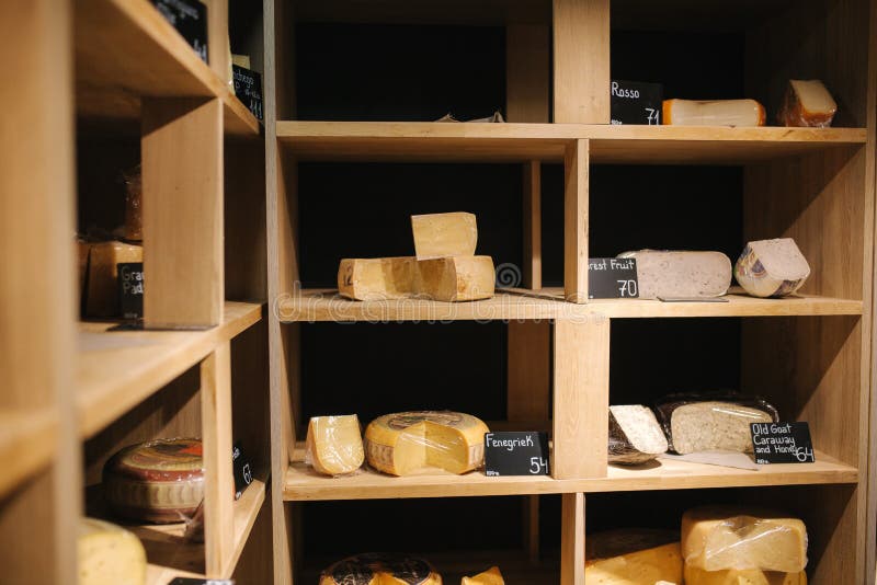 Shelf with Cheese in Cheese Store. Assortment of Different Cheese Types ...