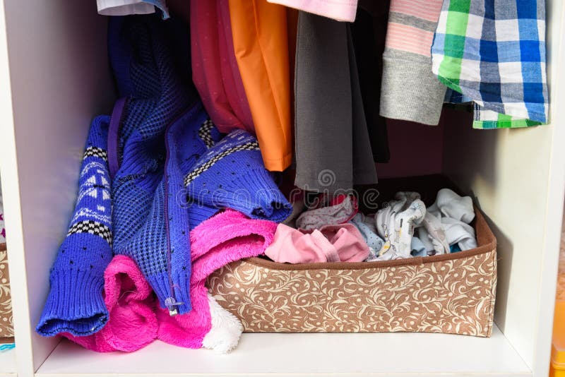 On the Shelf in the Children`s Closet, Children`s Things are Casually ...