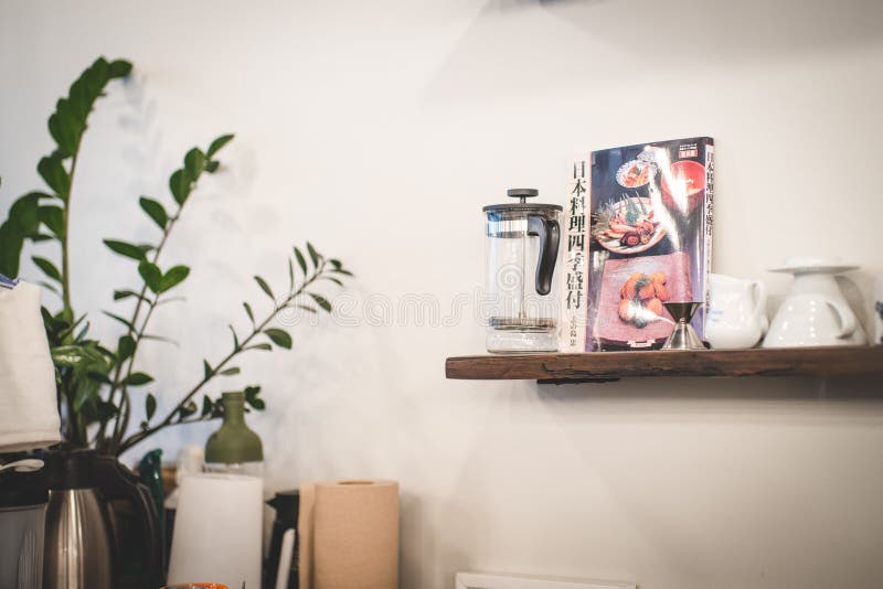 A Shelf in the Corner of a Coffee Shop with a Book on Top of it ...