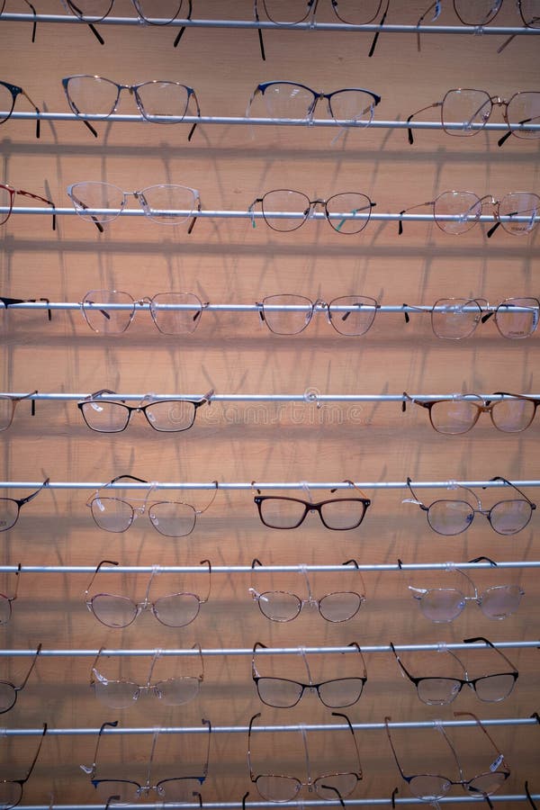 Shelf with Different Models of Eyeglasses Hangs in an Eyeglass Store ...