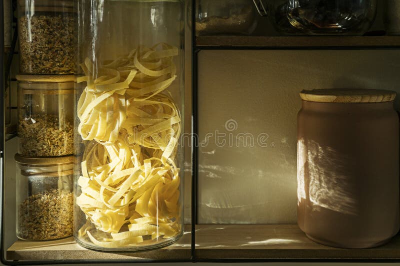 A Shelf Full of Jars with Cooking Ingredients and Nests Stock Photo ...