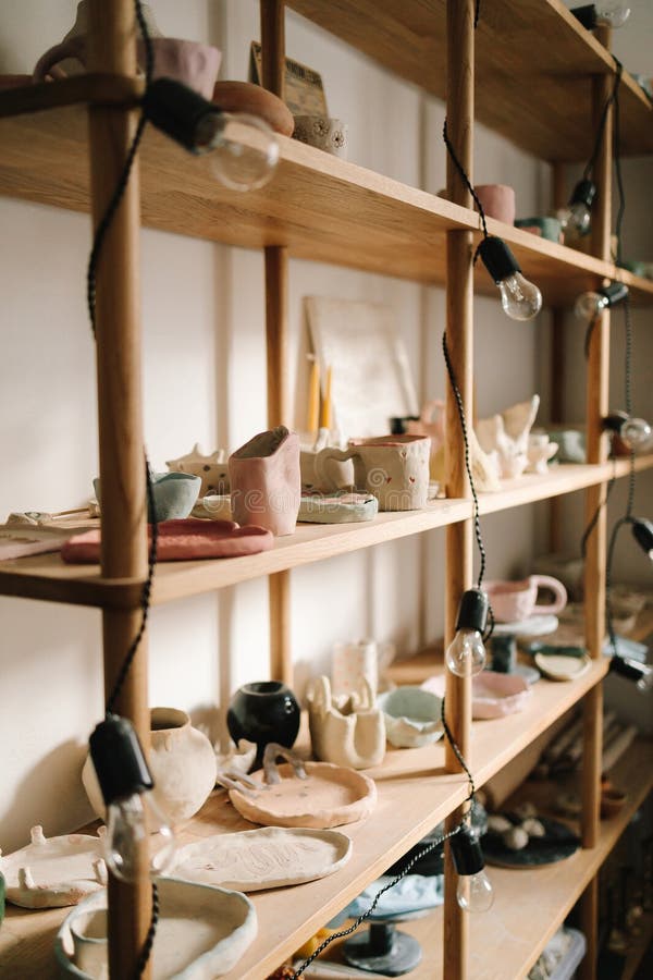 Shelf with Handmade Clay Cups and Plates in the Pottery Studio ...