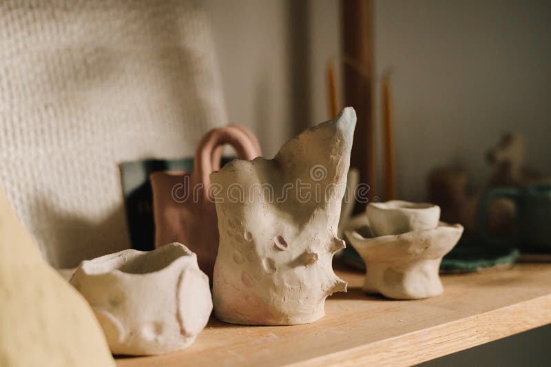 Shelf with Handmade Clay Cups and Plates in the Pottery Studio ...