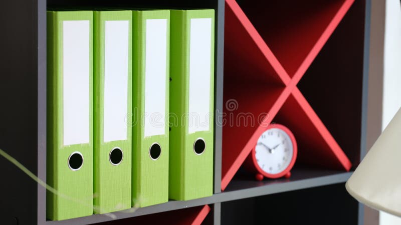 Shelf with Office Folders with Documents and Alarm-clock Stock Image ...