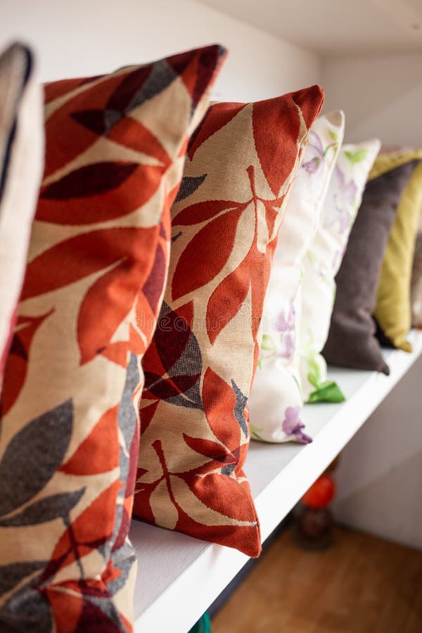 Shelf with Several Cushions with Different Styles and Colors Stock ...