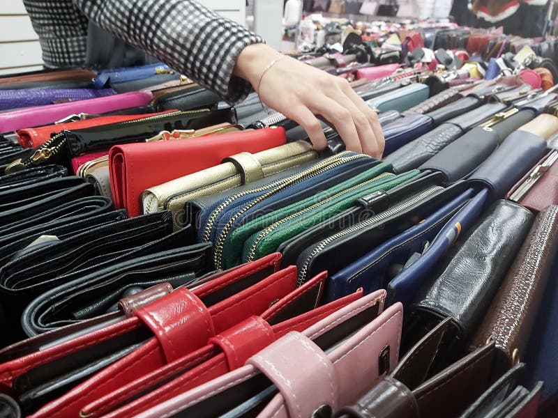 Shelf with Wallets, a Girl Chooses a Wallet in the Store Stock Image ...