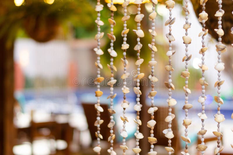 Shell Curtain with Blurred Pool in the Background and Blurred Pool ...