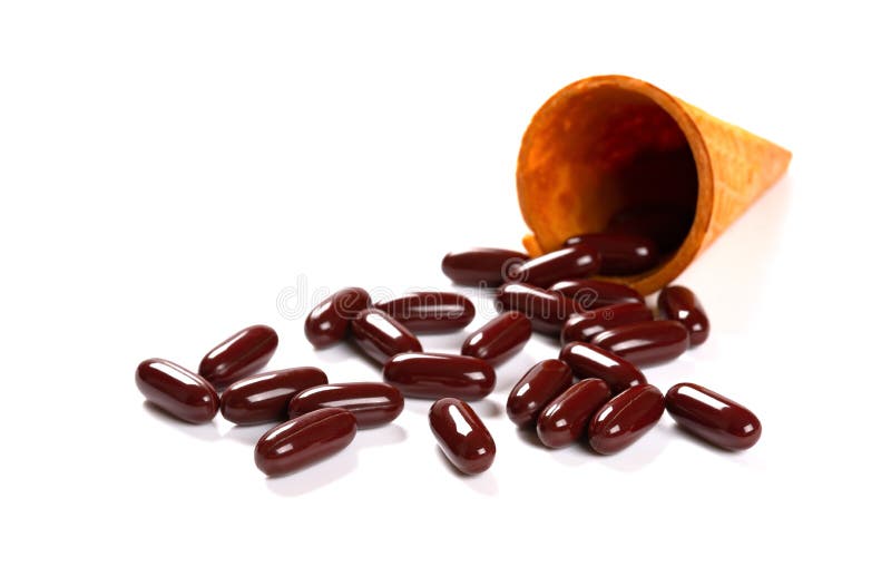 Shell of an Ice Cream Cone with Capsules on White Concept of Healthy ...