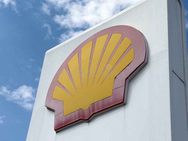 Shell Logo Sign on Outdoor White Structure with Blue Sky Background ...