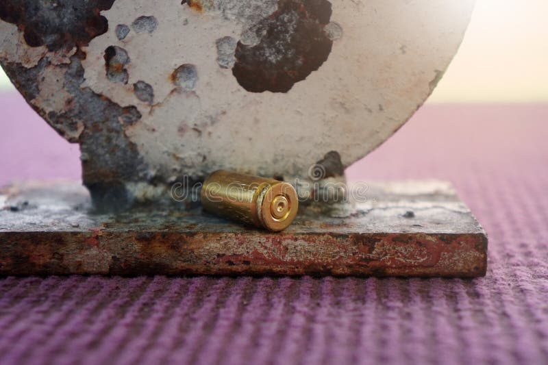A Shell of 9mm Fired Bullet on Metal Shooting Target. Stock Photo ...