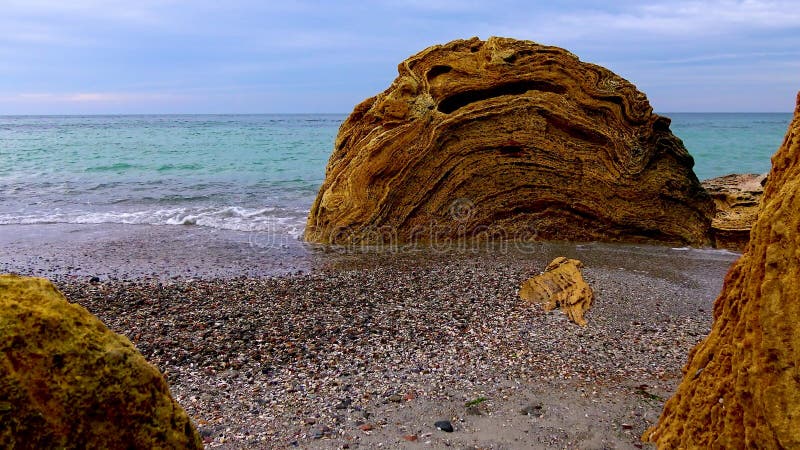 Shell Rock with Curved Layers on a Beach by the Sea, Geological ...