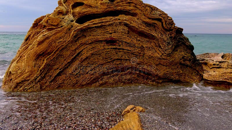 Shell Rock with Curved Layers on a Beach by the Sea, Geological ...