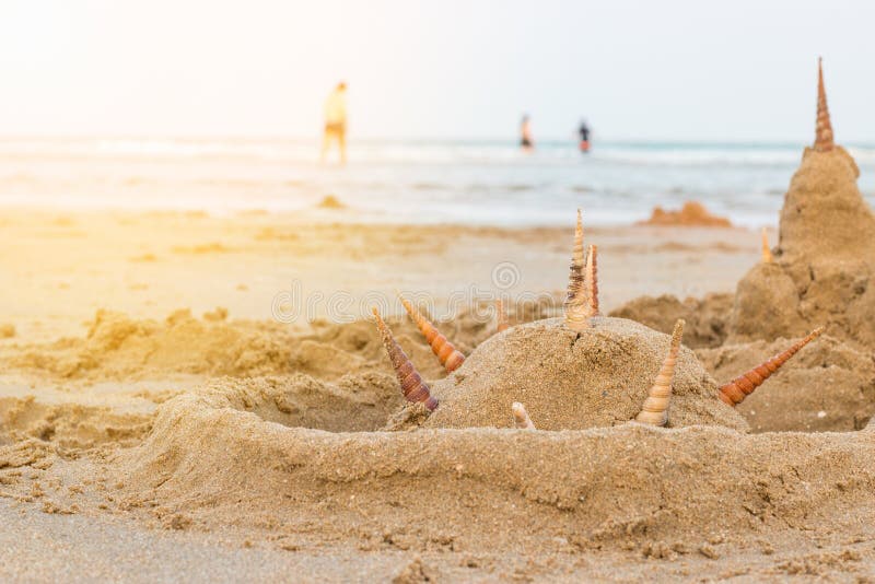 Shell Sand Castles on the Beach Stock Photo - Image of bucket, sunlight ...
