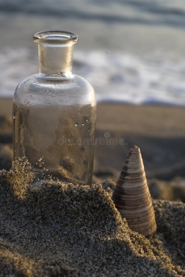 Shells and a bottle stock image. Image of peace, sand - 2635141