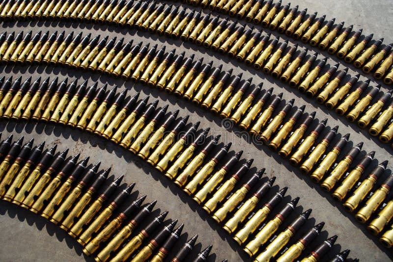 Shells for a Heavy Machine Gun. Rows of Ammunition for Firearms Lie on ...