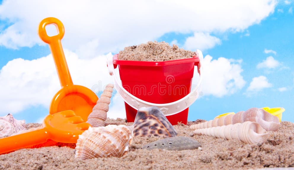 Shells and Plastic Beach Toys Stock Image - Image of break, color: 14605027