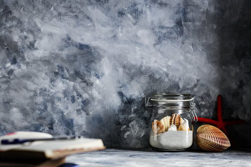 Shells, Sand, Jar, Plants on Dark Mood Wall Background. Table ...