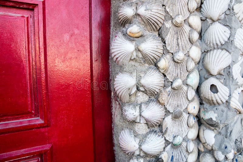 Shells wall and red door stock image. Image of design - 258770299