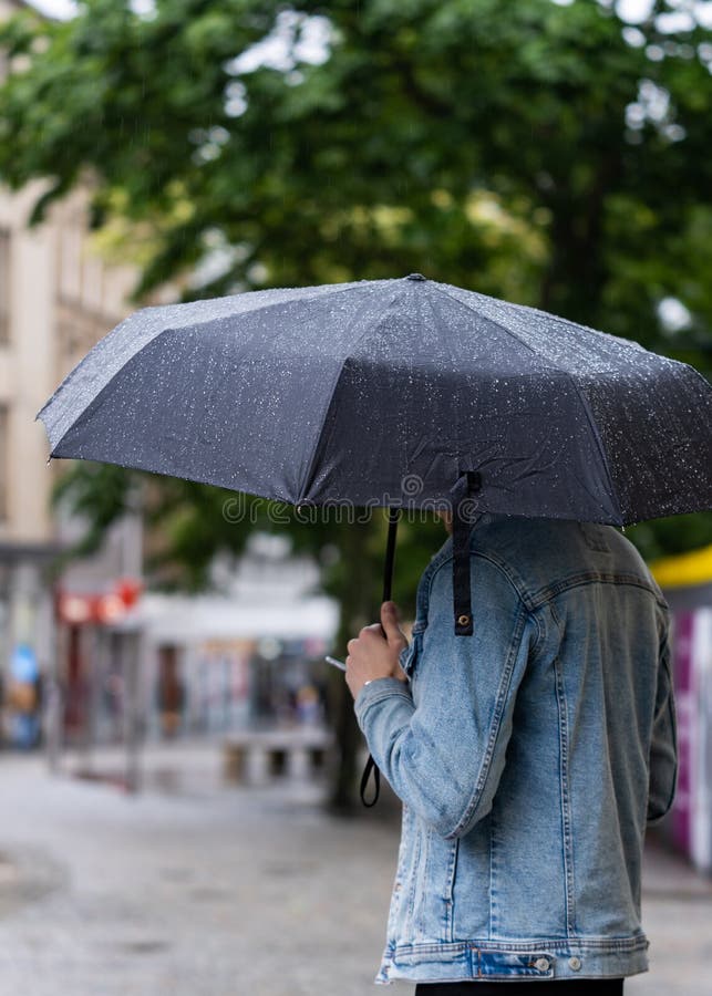 Sheltering from the Heavy Storm Rain Under Umbrella with Beads of Water ...