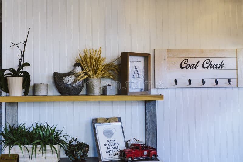Shelves with Decoration and Plants. Coat Check Rack Hanging on the ...