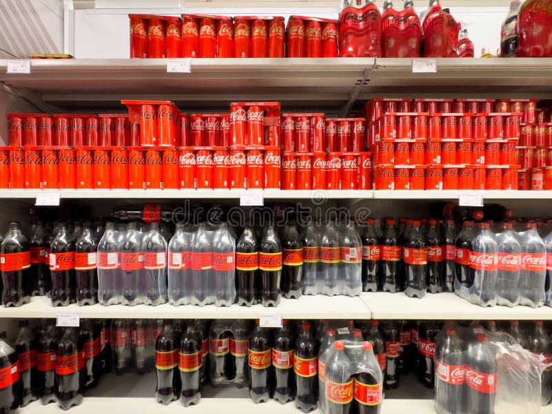 Shelves Filled with Various Coca-cola Bottles and Cans in a Store ...