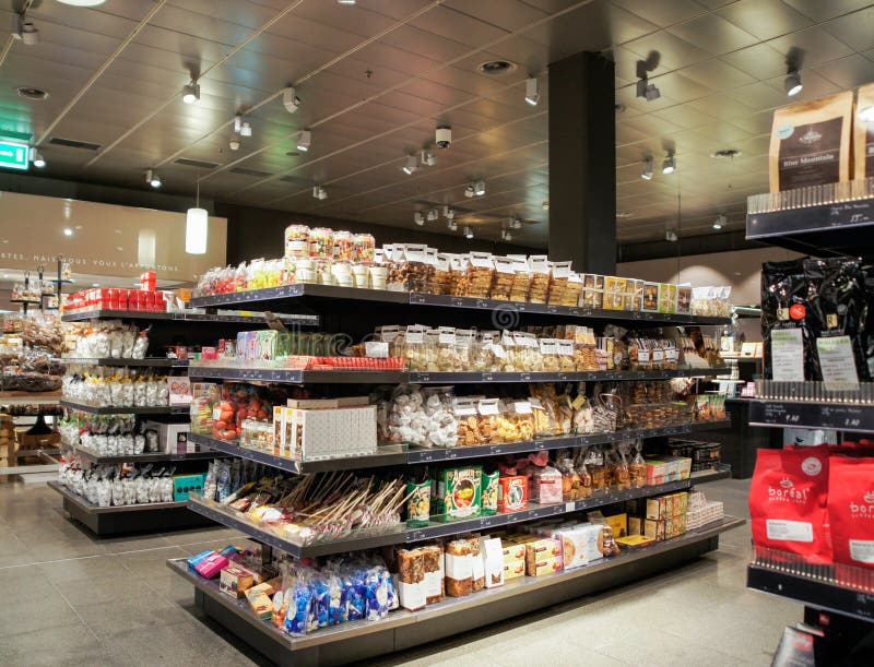 Shelves with the goods. editorial image. Image of people - 124892785