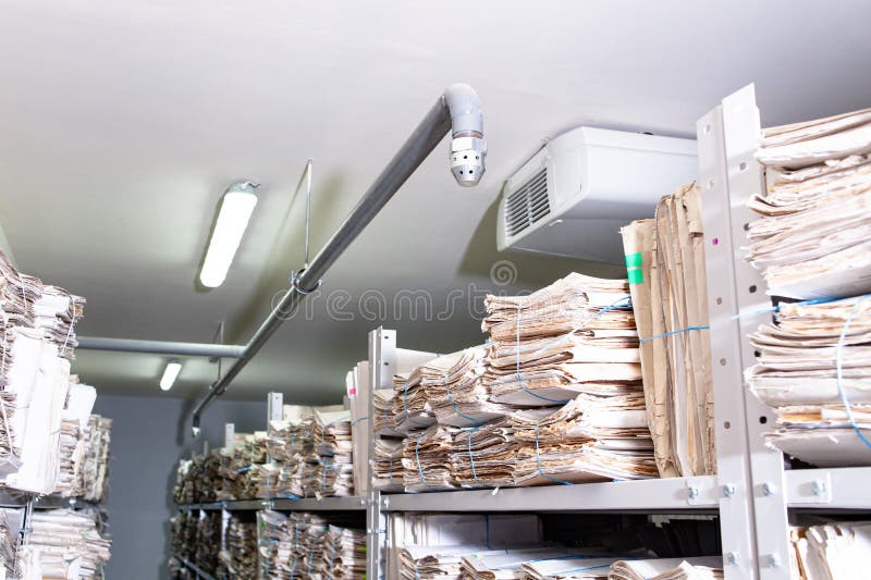 Shelves with Paper Documents. Fire Extinguishing System in the Room ...
