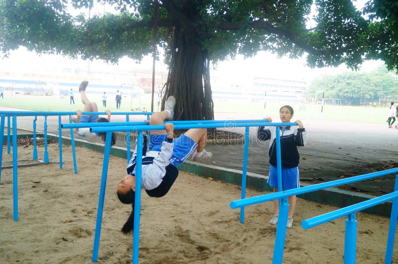 Shenzhen, China: Female Middle School Students in the Horizontal Bar ...