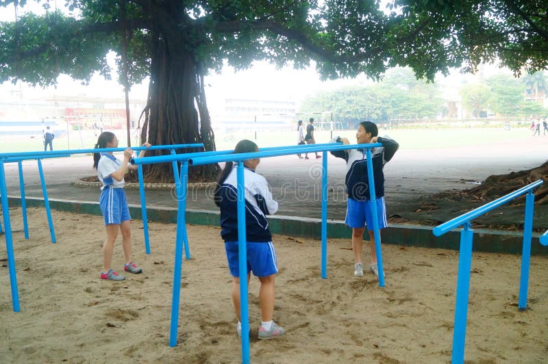 Shenzhen, China: Female Middle School Students in the Horizontal Bar ...