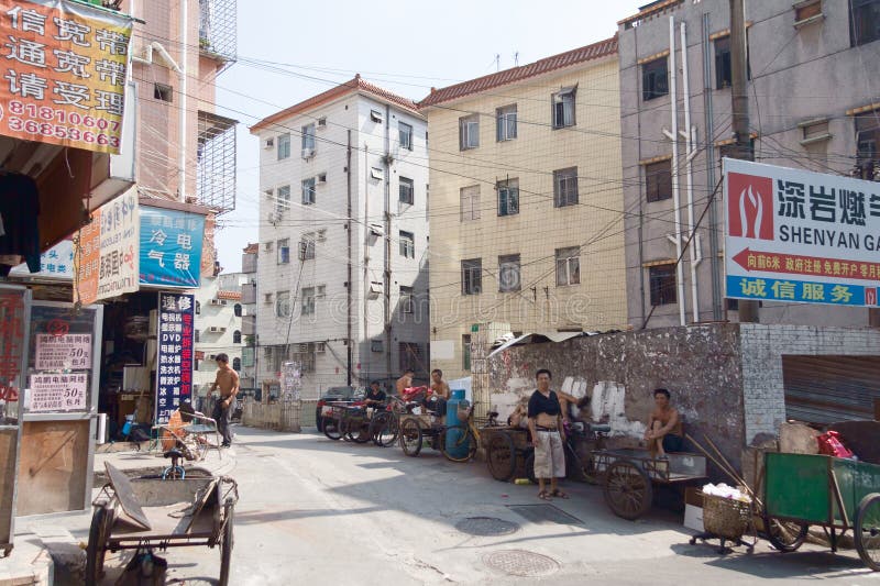 SHENZHEN, CHINA, 2011-07-24: View To Resting Workers in Poor Dis ...