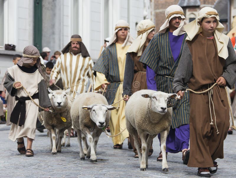 Sheperds in Mid-eastern Clothing Marshing through the Street Editorial ...