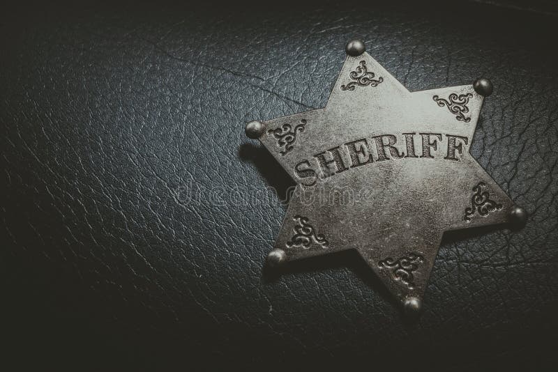Sheriff Badge on Black Leather Texture Background. Stock Image - Image ...