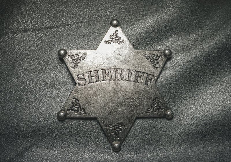 Sheriff Badge on Gray Leather Texture Background. Stock Photo - Image ...