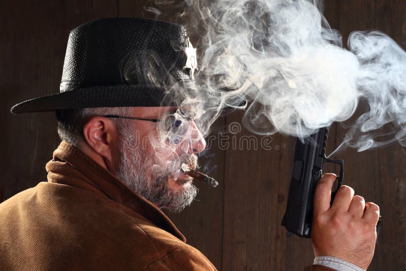 Sheriff smoking a cigar stock image. Image of criminal - 95657393