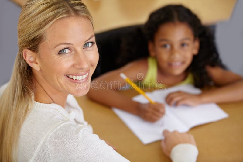 Shes a Dedicated Educator. Portrait of a Pretty Teacher Helping Her ...