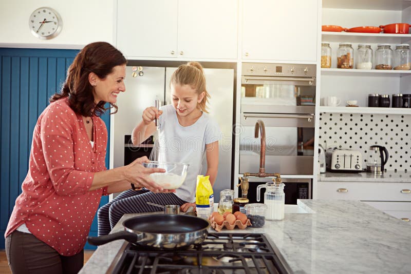 Shes Got a Knack for Baking. a Mother Baking with Her Daughter in the ...