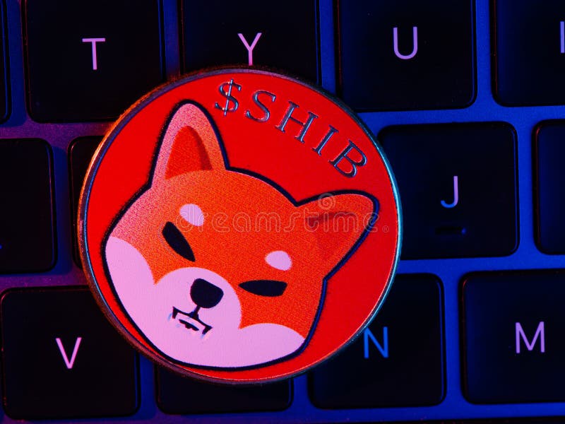 Shiba Inu Cryptocoin on the Keyboard of a Personal Computer, Laptop ...