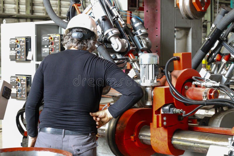 Shief Engineer Setting Up the Machine Steel Cutting Machine, Steel Bar ...