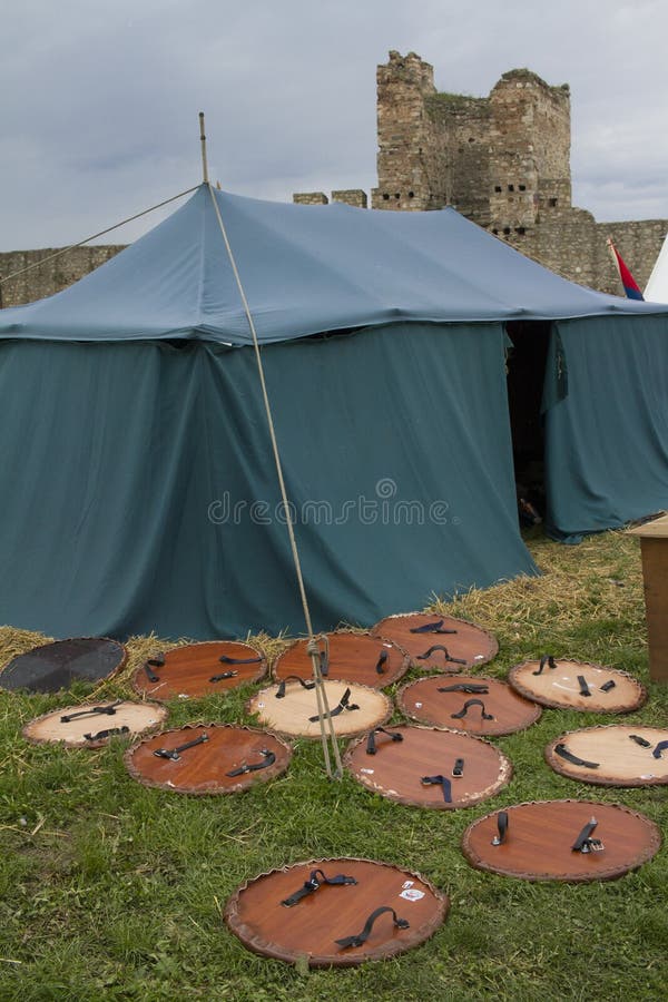Shields in front of a tent editorial photography. Image of armor ...