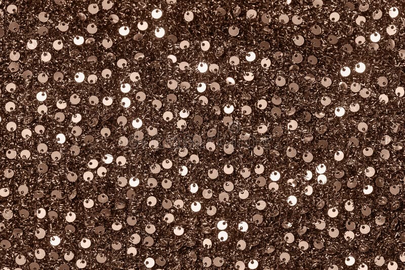 A Shimmering Gold Ornament Hanging from a String Stock Photo - Image of ...