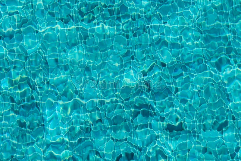 The Shimmering Turquoise Surface of a Tranquil Pool Reflecting Sunlight ...