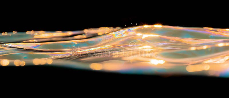 Shimmering Water Bubbles Reflecting Light Against a Dark Background ...