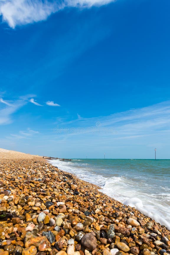 Shingle Shore Beach stock photo. Image of clouds, water - 43399614