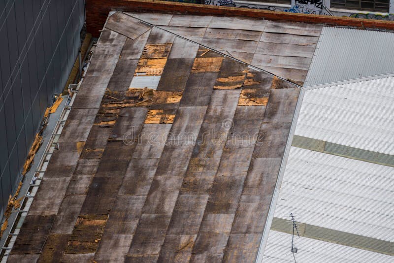 Destroyed and damaged roof stock photo. Image of shingles - 135890232