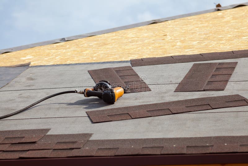 Shingles Roof Ventilation for Heat Control with Nailgun Stock Image ...