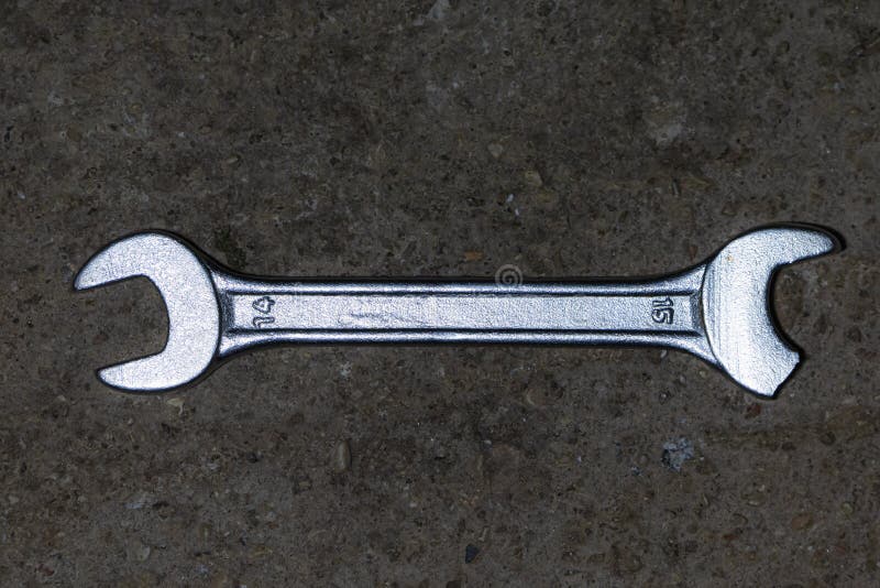 Shining Broken Wrench. Work Tool Failure on Cement Floor Stock Photo ...
