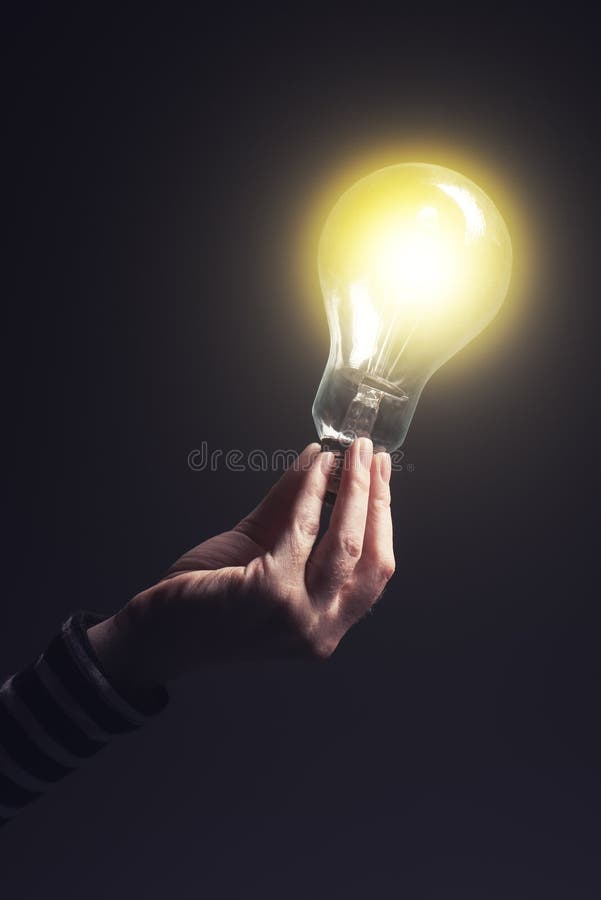 Shining Light Bulb in Female Hand Stock Photo - Image of hand ...