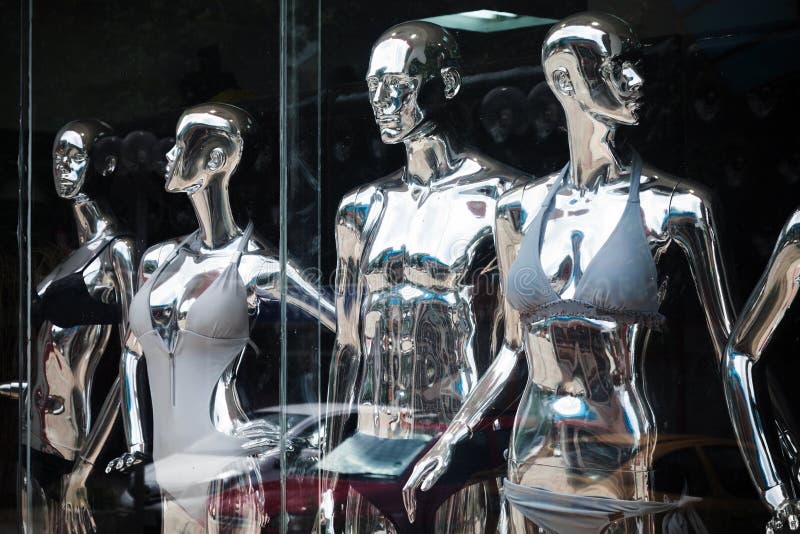 Shining Metallic Mannequins Standing in a Window Stock Photo - Image of ...